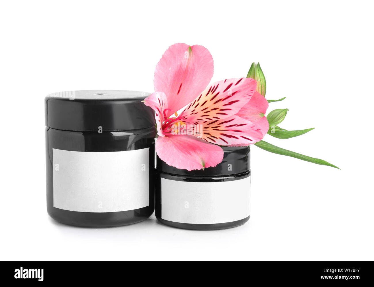 Shampoo and flower on white background Stock Photo - Alamy