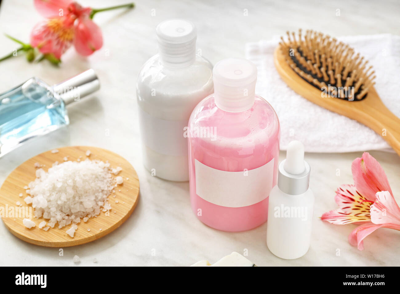 Different cosmetics for personal hygiene on white table Stock Photo - Alamy