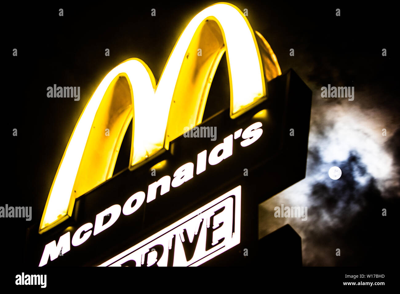 Lodz, Poland, Jan 2018 yellow McDonald's sign, night, clouds, moon in ...