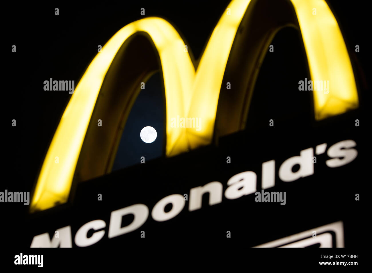 Lodz, Poland, Jan 2018 yellow McDonald's sign, night, clouds, moon in ...
