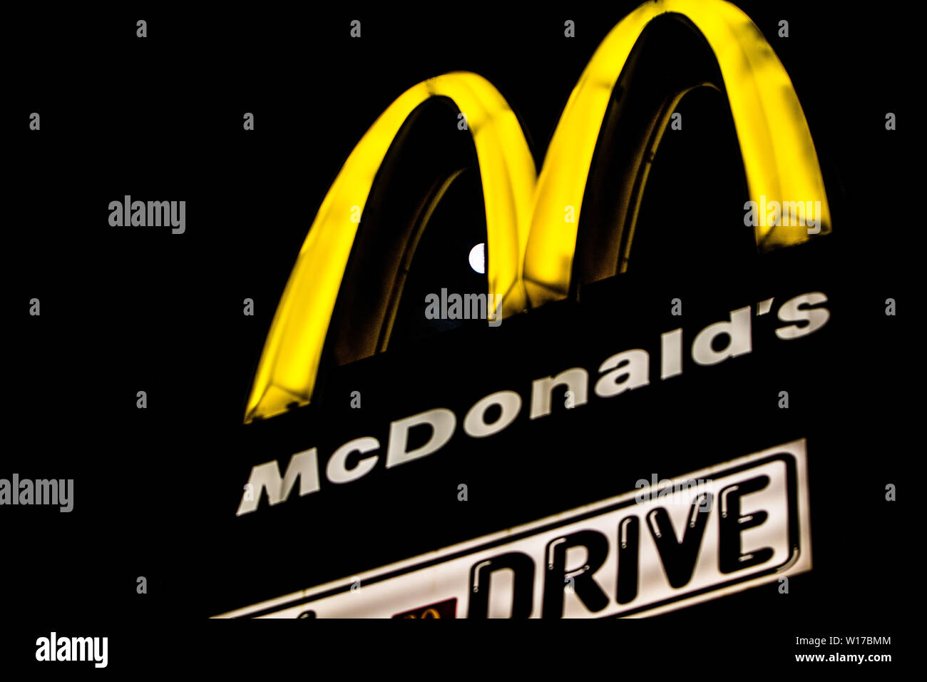 Lodz, Poland, Jan 2018 yellow McDonald's sign, night, clouds, moon in ...