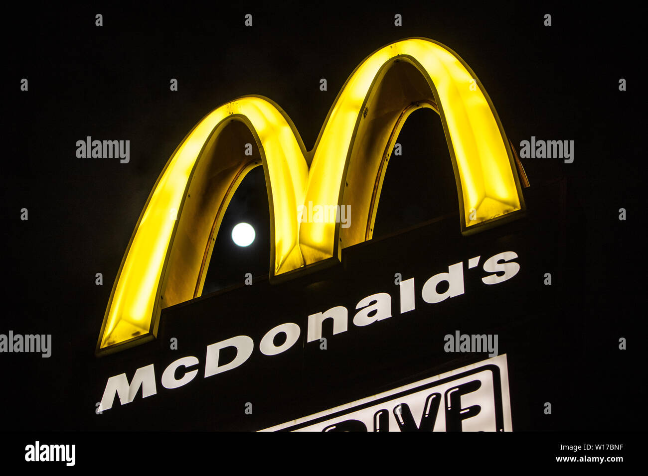 Lodz, Poland, Jan 2018 yellow McDonald's sign, night, clouds, moon in ...