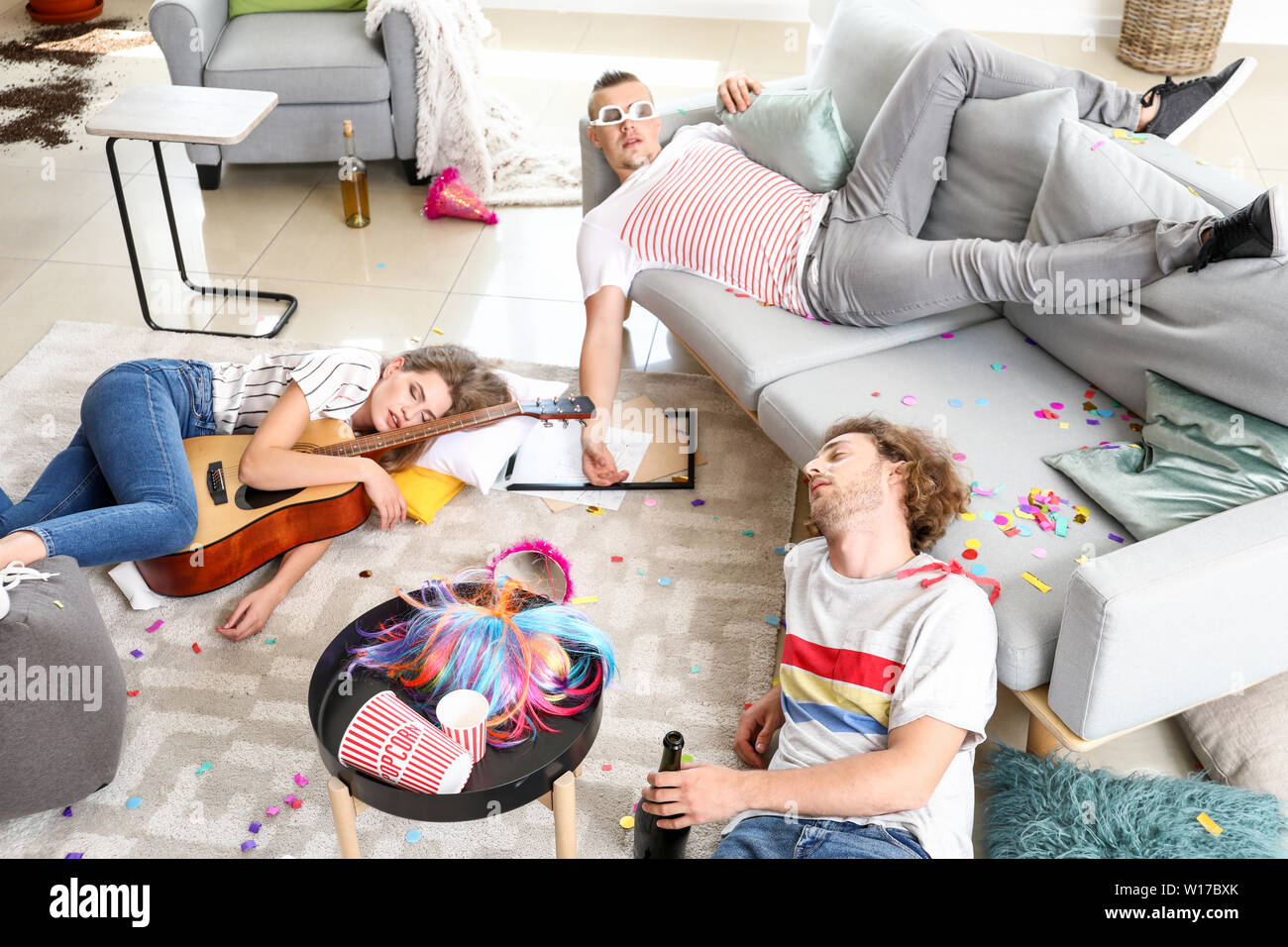 Young people sleeping after party at home Stock Photo - Alamy