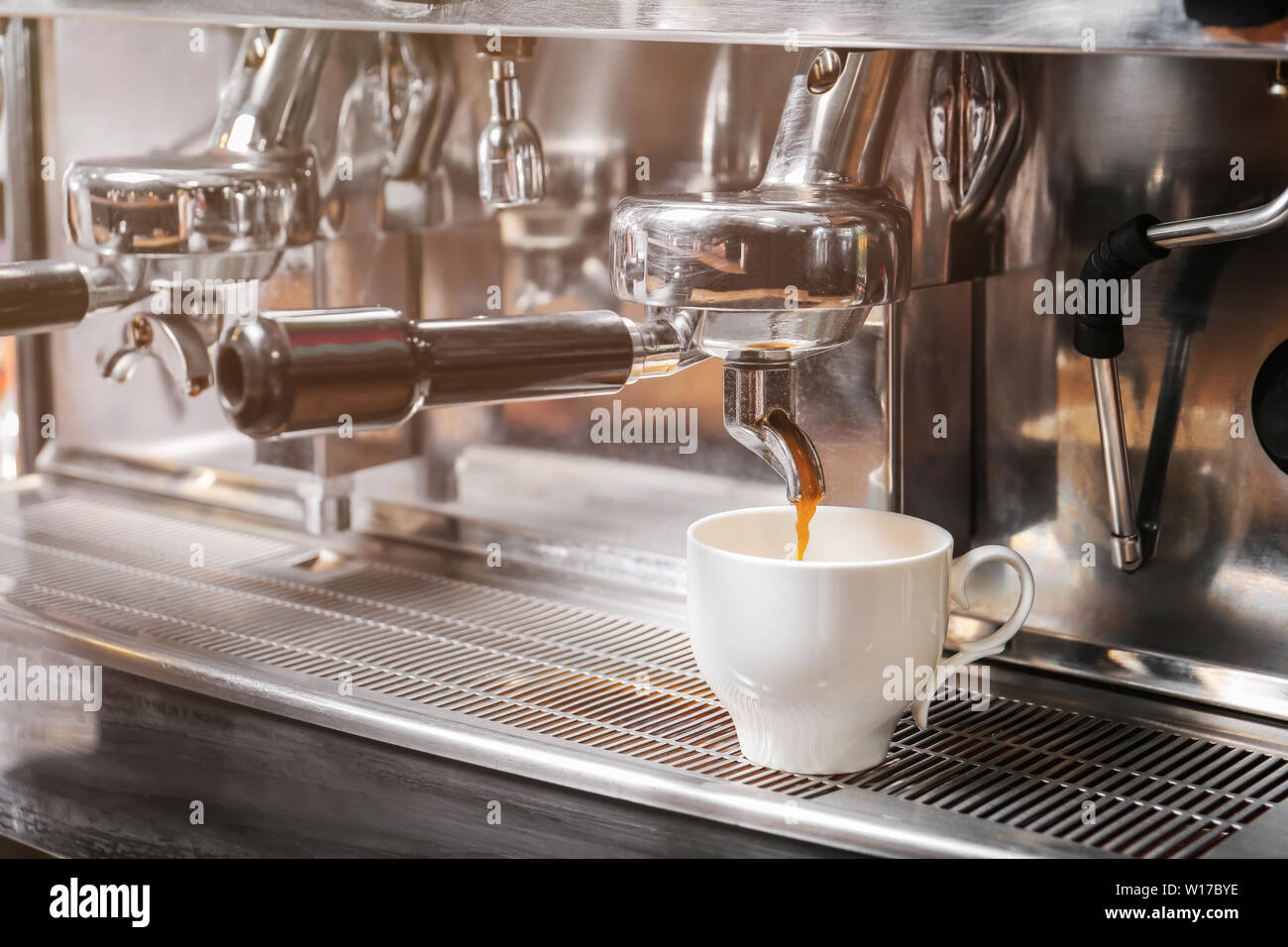 Modern coffee machine making coffee Stock Photo - Alamy