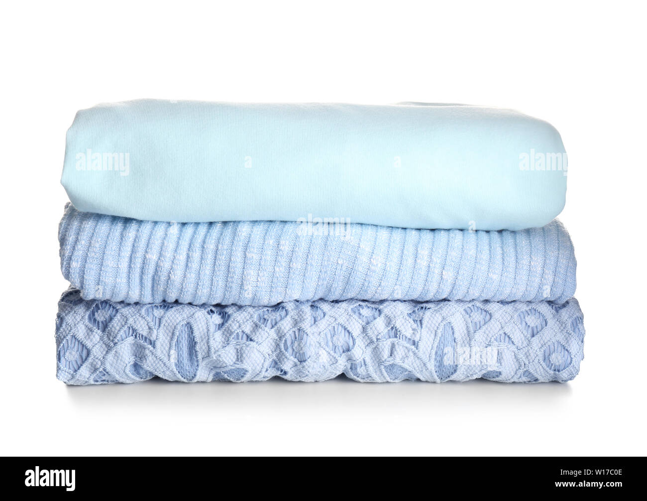 Stack of modern clothes on white background Stock Photo - Alamy
