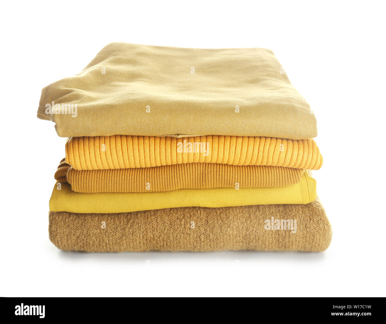Stack of modern clothes on white background Stock Photo - Alamy