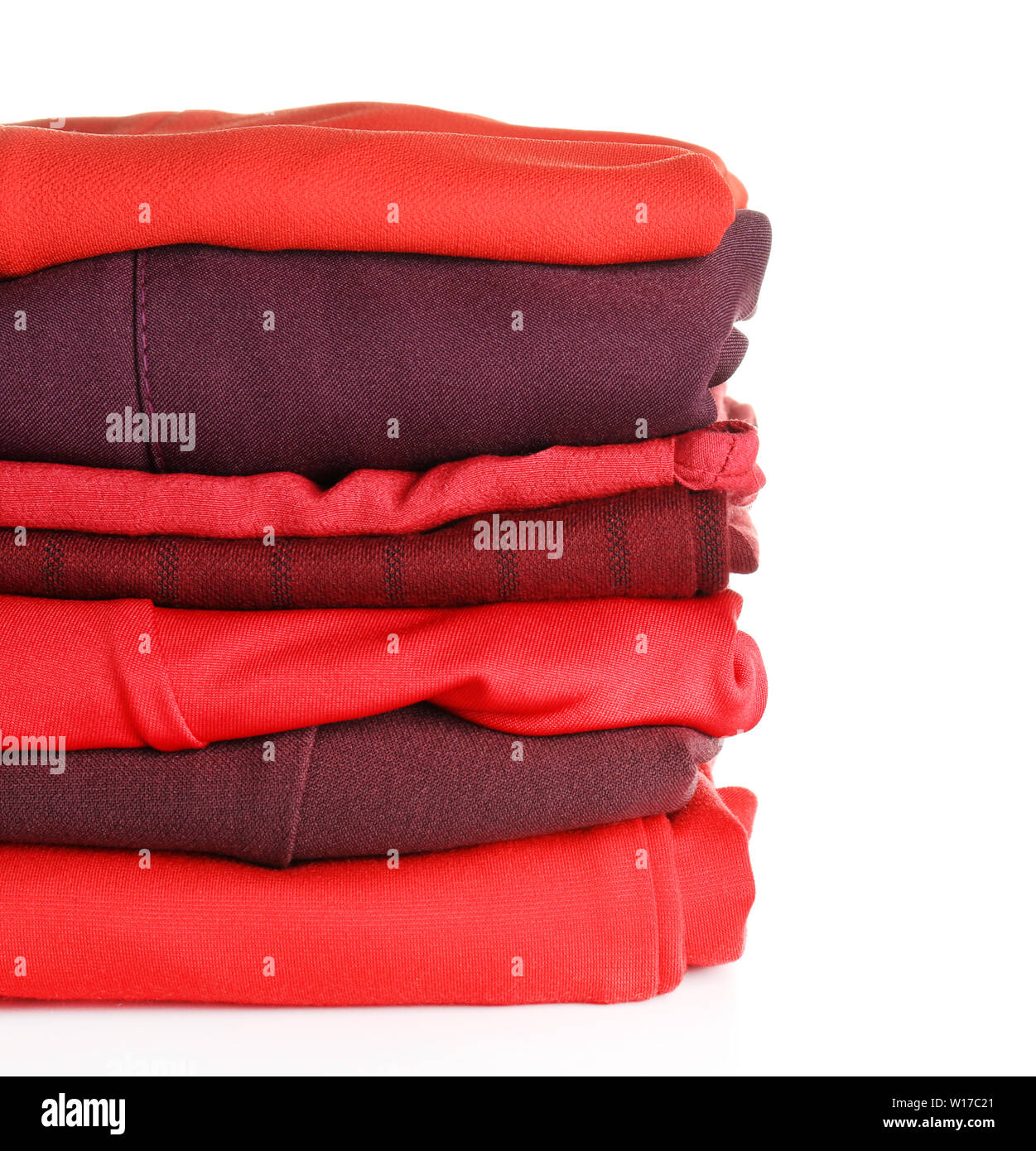 Stack of modern clothes on white background Stock Photo - Alamy