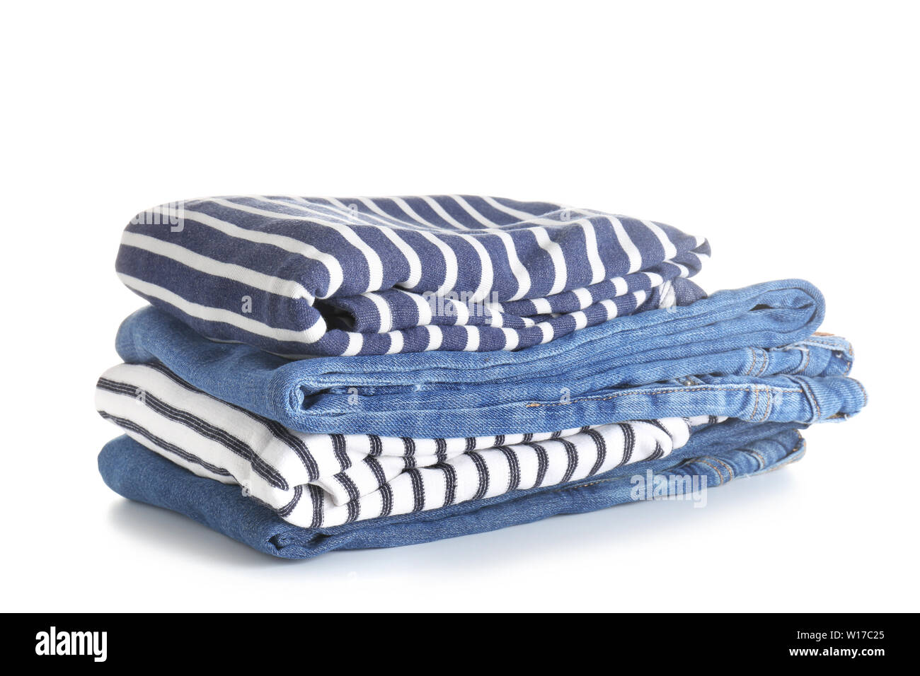 Stack of modern clothes on white background Stock Photo - Alamy
