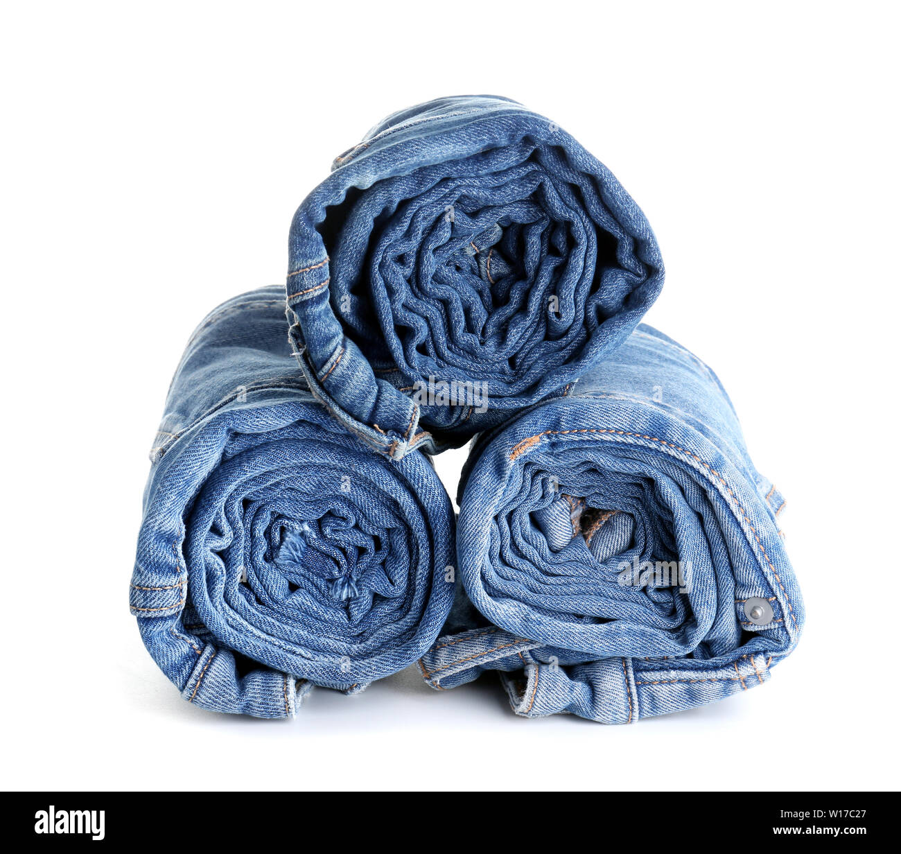 Stack of jeans clothes on white background Stock Photo - Alamy