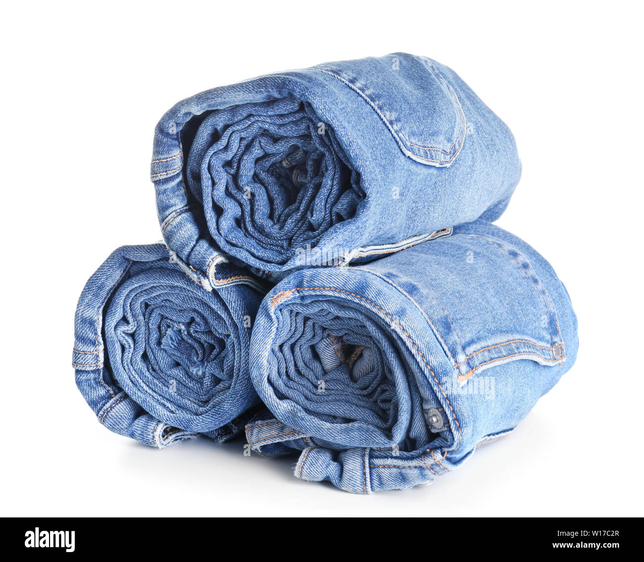 Stack of jeans clothes on white background Stock Photo - Alamy