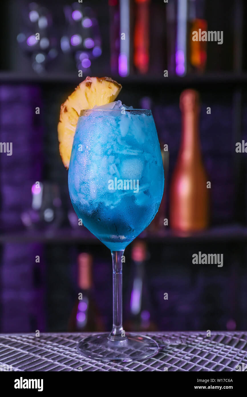 Glass of Blue Lagoon cocktail on table in bar Stock Photo - Alamy