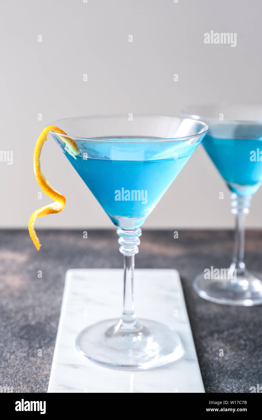 Glass of Blue Lagoon cocktail on table Stock Photo - Alamy