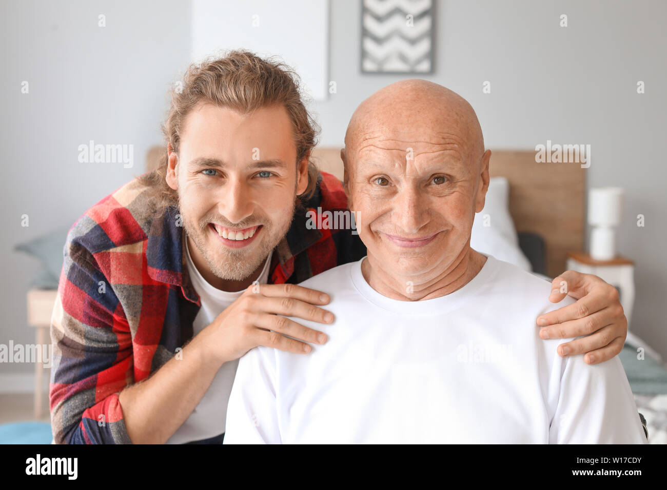 Young man visiting his father in nursing home Stock Photo - Alamy