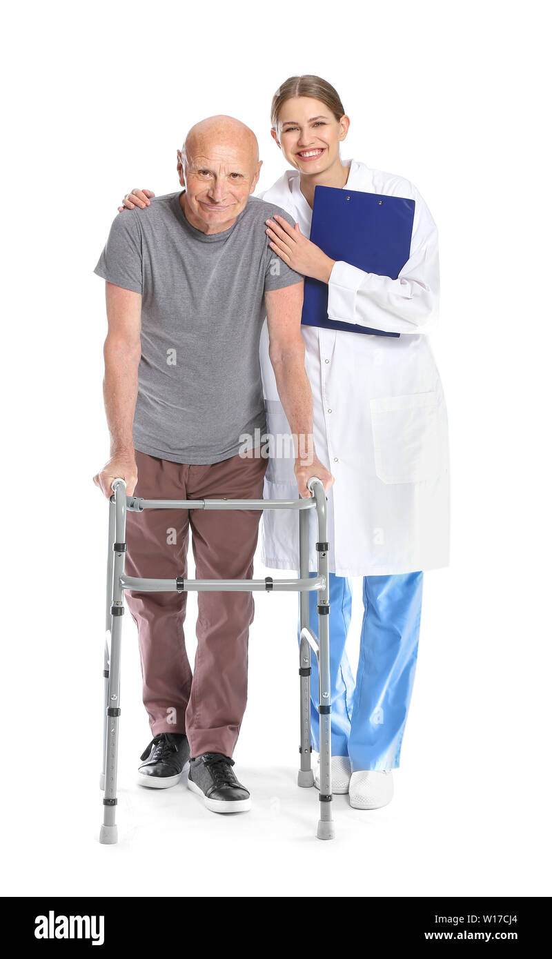 Elderly man with doctor on white background Stock Photo - Alamy