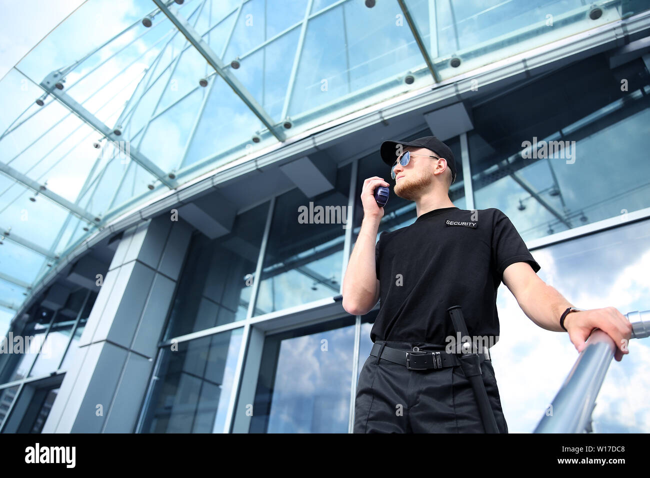 Handsome male security guard outdoors Stock Photo - Alamy
