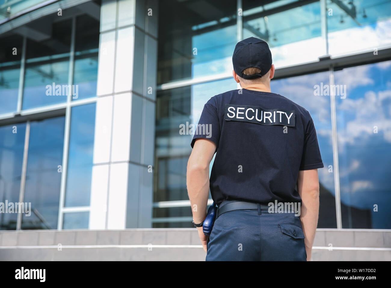 Handsome male security guard outdoors Stock Photo - Alamy