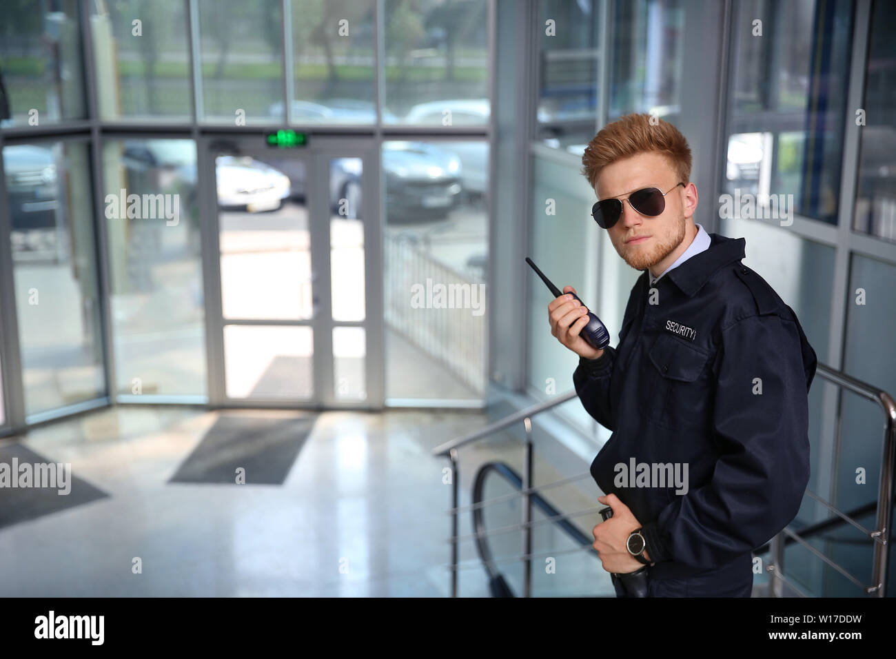 Male security guard in building Stock Photo - Alamy