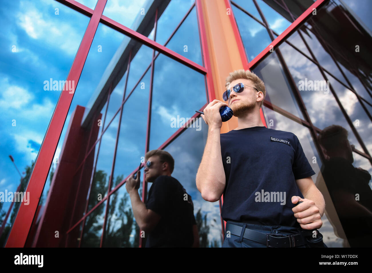 Handsome male security guard outdoors Stock Photo - Alamy