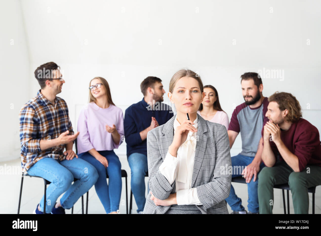 Female psychologist at group therapy session Stock Photo - Alamy