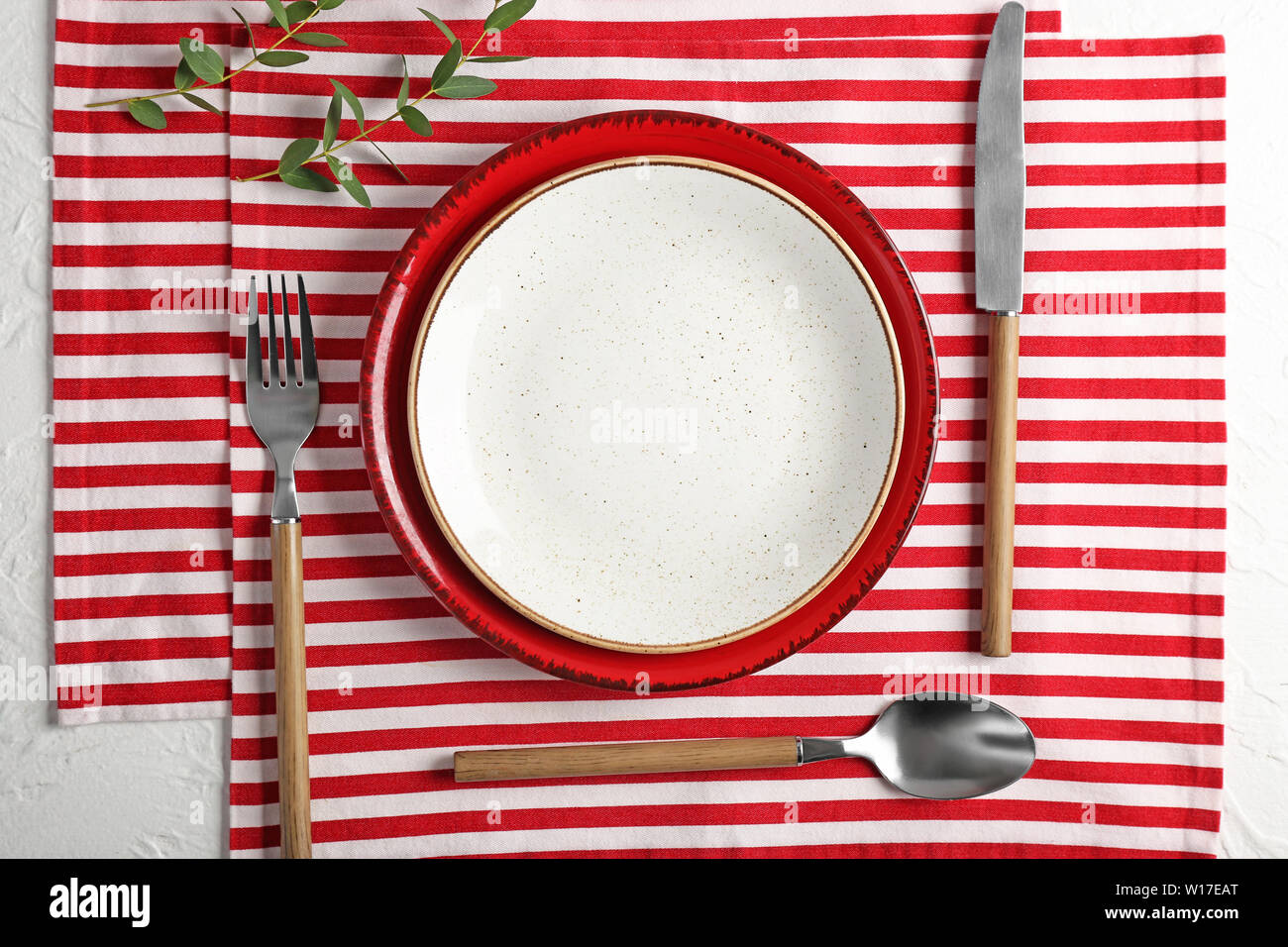 Beautiful table setting on white background Stock Photo - Alamy