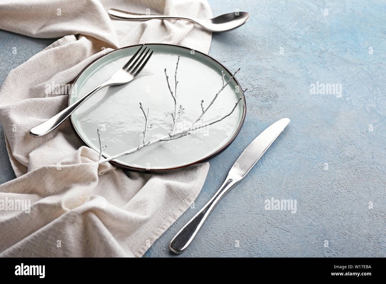 Beautiful table setting on light background Stock Photo - Alamy