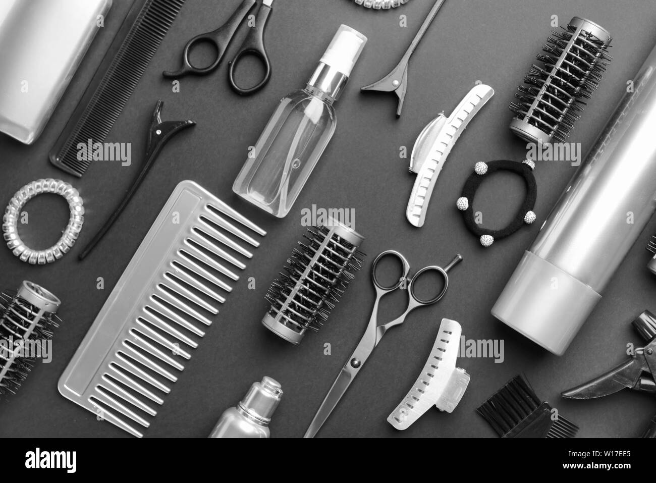 Set of hairdresser tools and accessories on dark background Stock Photo ...