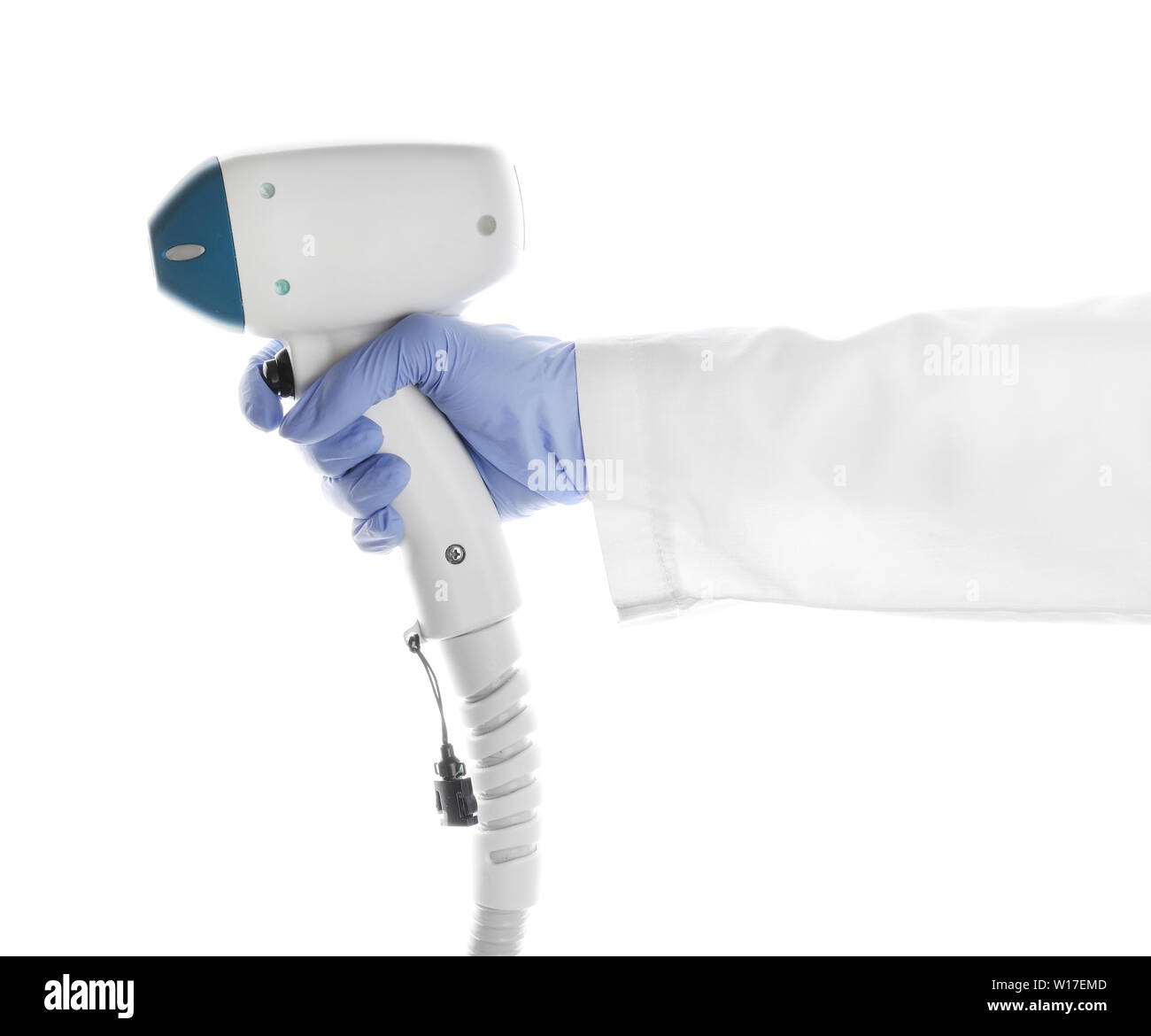 Hand of cosmetician with equipment for laser hair removing on white ...