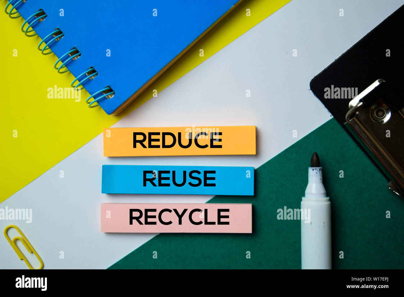 Reduce. Reuse. Recycle text on sticky notes with office desk concept ...
