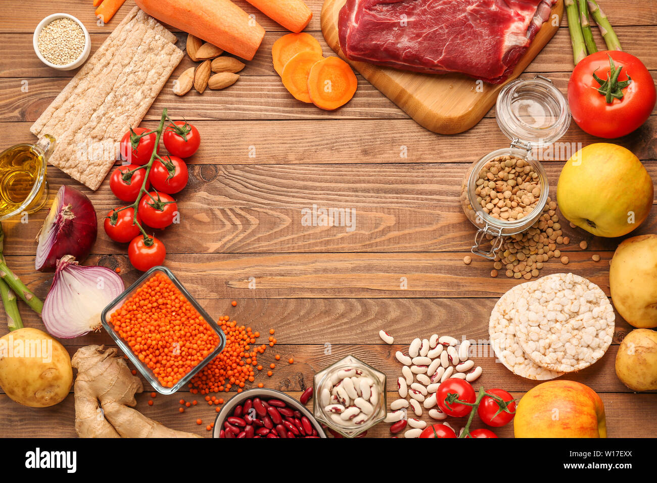 Frame made of different healthy food on wooden background Stock Photo ...