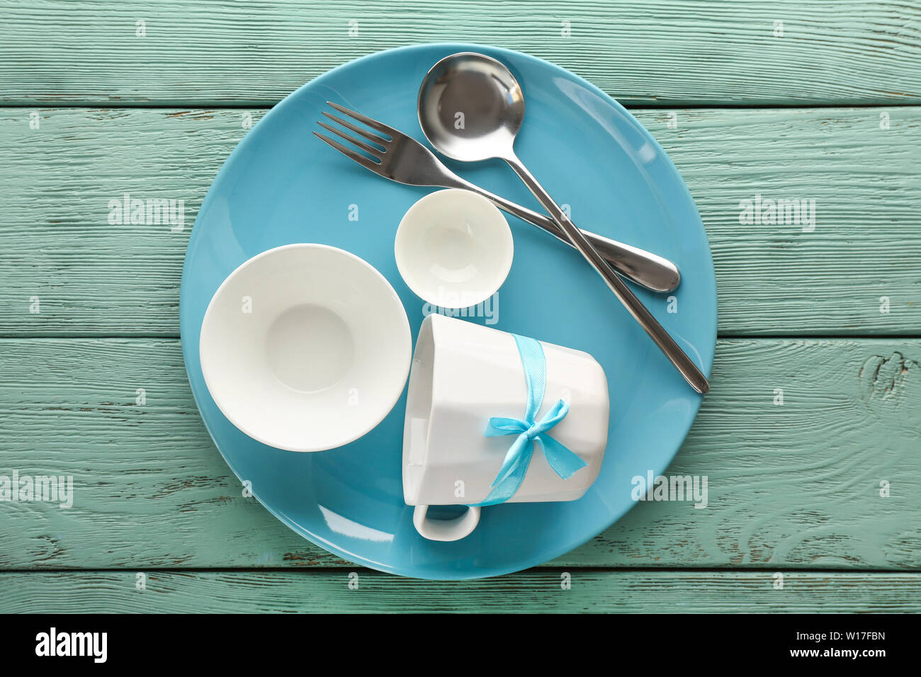 Simple table setting on wooden background Stock Photo - Alamy