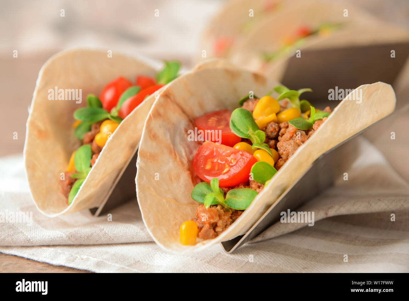 Tasty fresh tacos on table, closeup Stock Photo - Alamy
