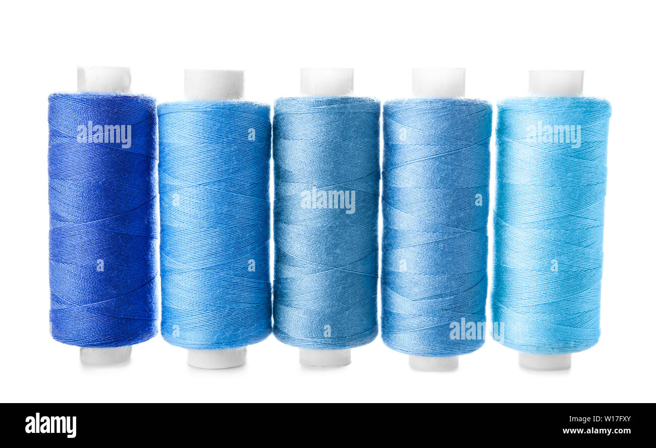 Colorful sewing threads on white background Stock Photo - Alamy