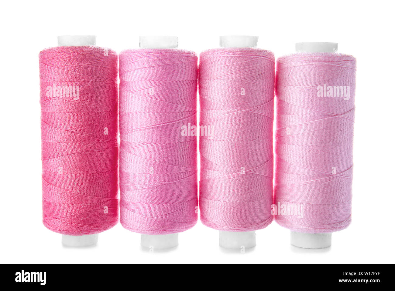 Colorful sewing threads on white background Stock Photo - Alamy