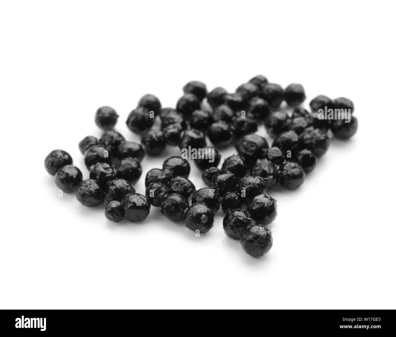 Delicious black caviar on white background Stock Photo - Alamy