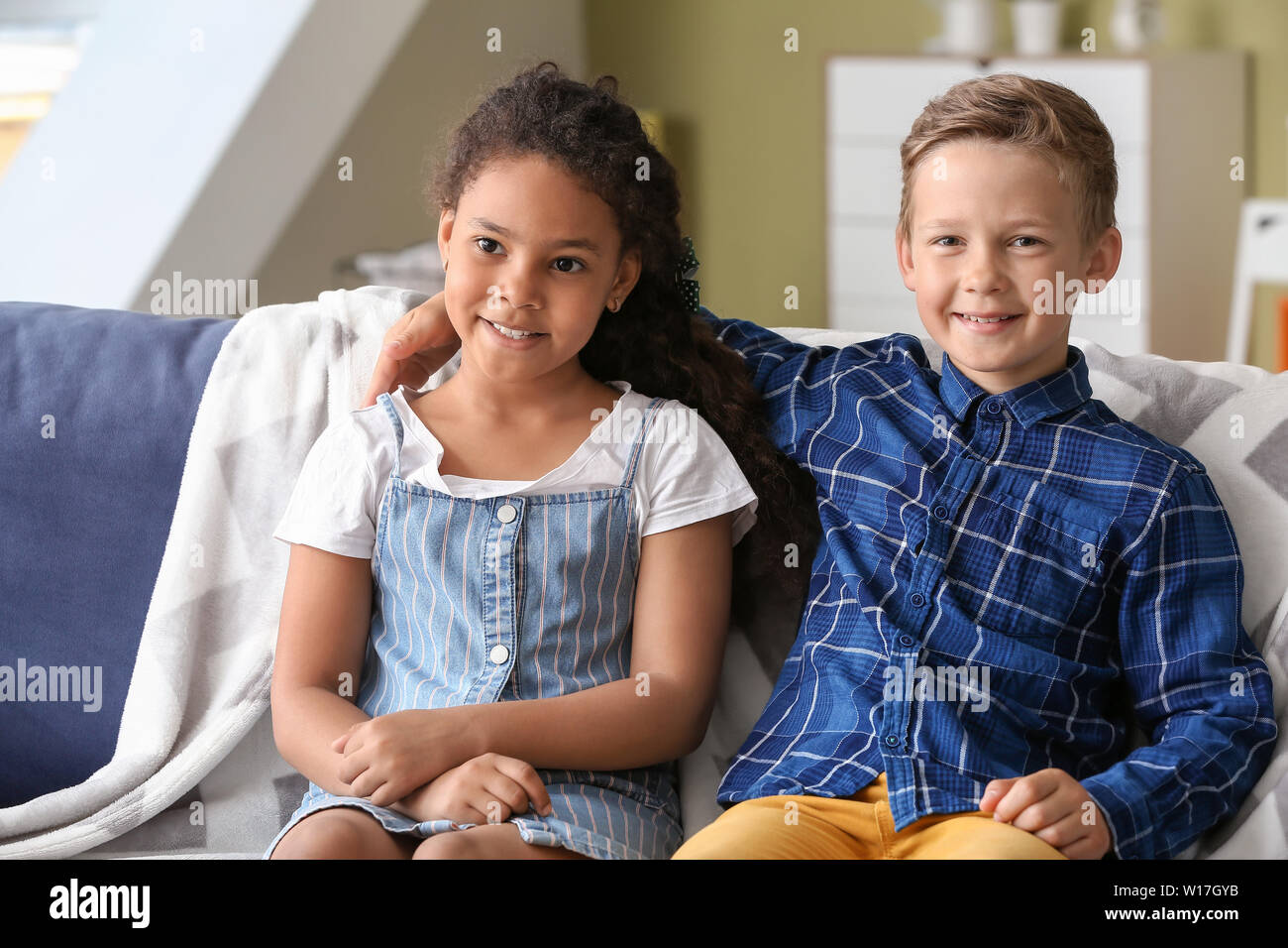 Happy adopted children in their new home Stock Photo - Alamy