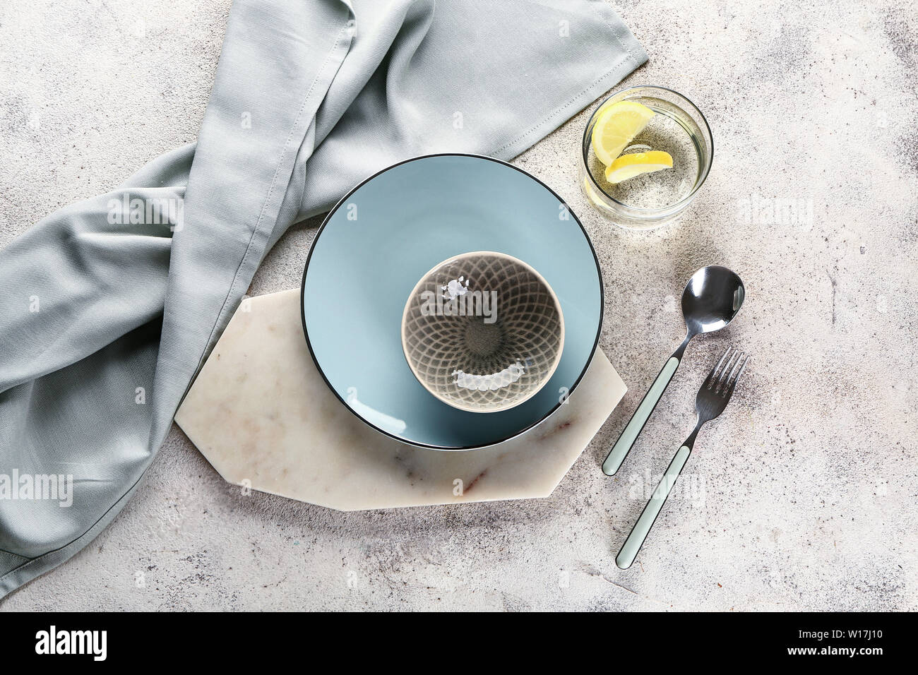 Set of tableware on grey background Stock Photo - Alamy
