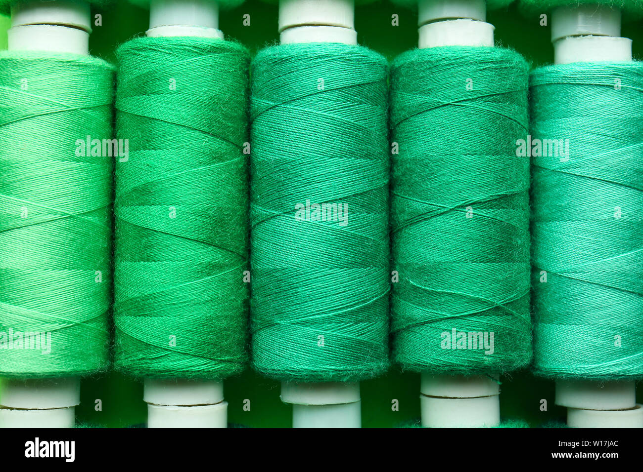 Many sewing threads as background Stock Photo - Alamy