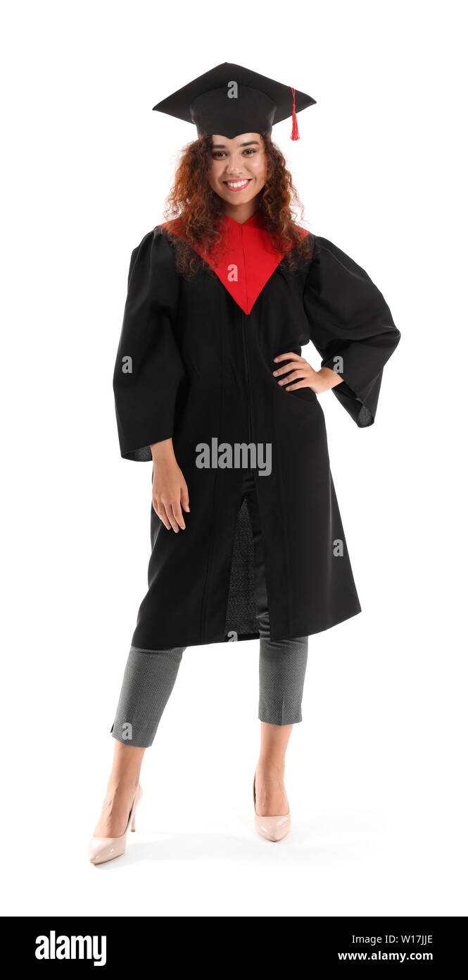 Young African-American student in bachelor robe on white background ...