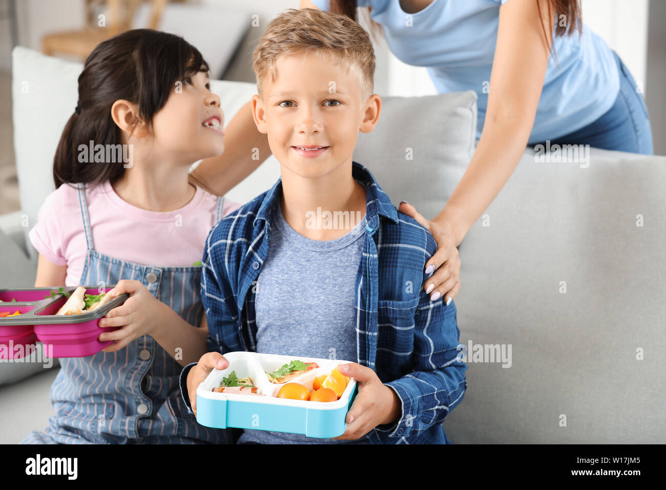 Little children with lunch boxes before school Stock Photo - Alamy