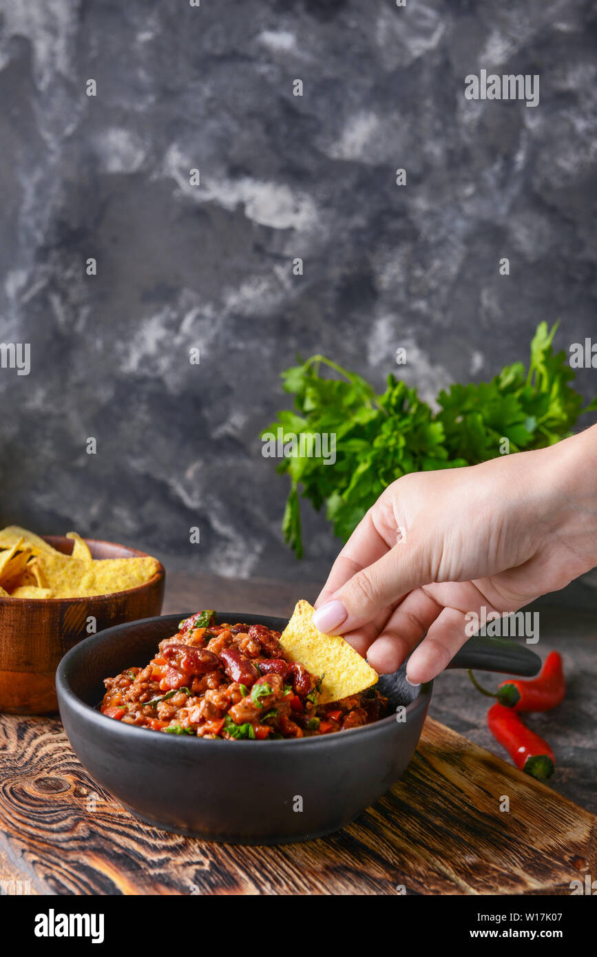 Woman holding nachos delicious hi-res stock photography and images - Alamy