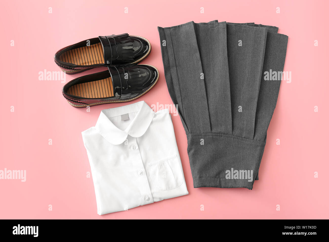 School uniform on color background Stock Photo - Alamy