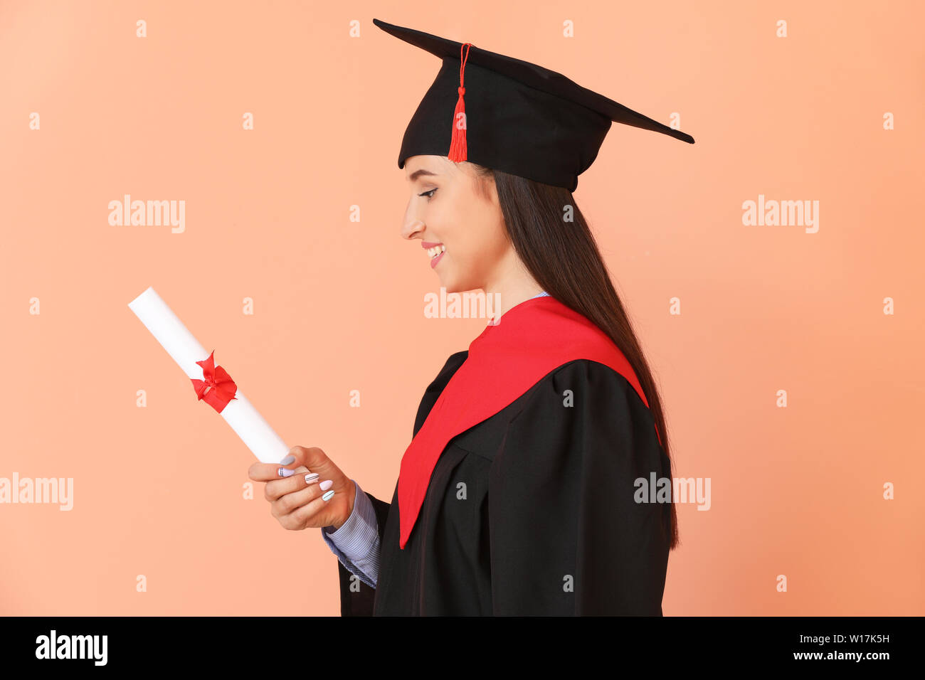 Female graduate with diploma on color background Stock Photo - Alamy