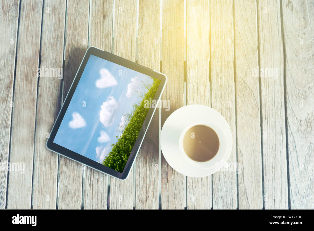 Black tablet ipad on table desk with coffee cup Stock Photo - Alamy