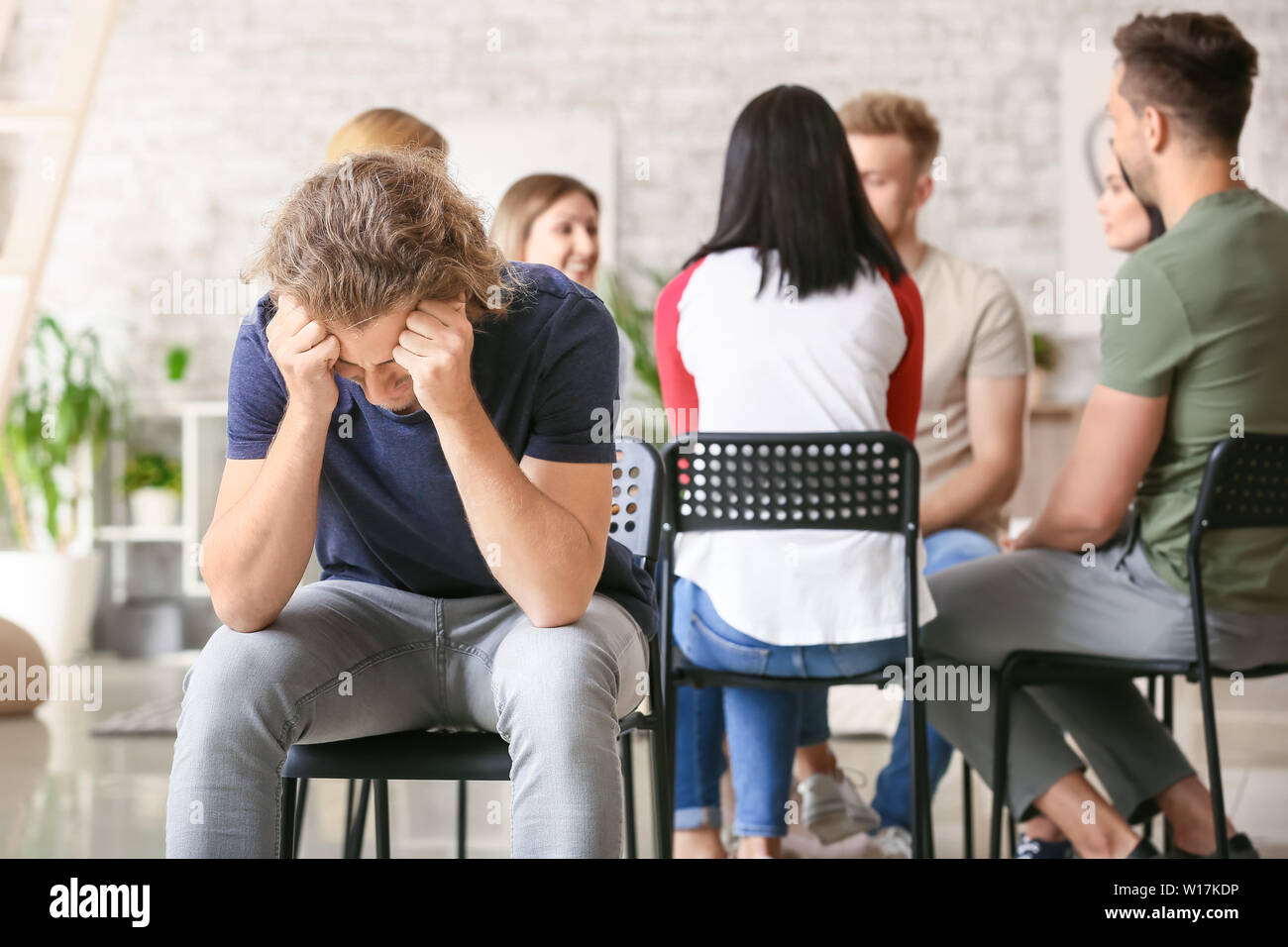 Depressed man at group therapy session Stock Photo - Alamy