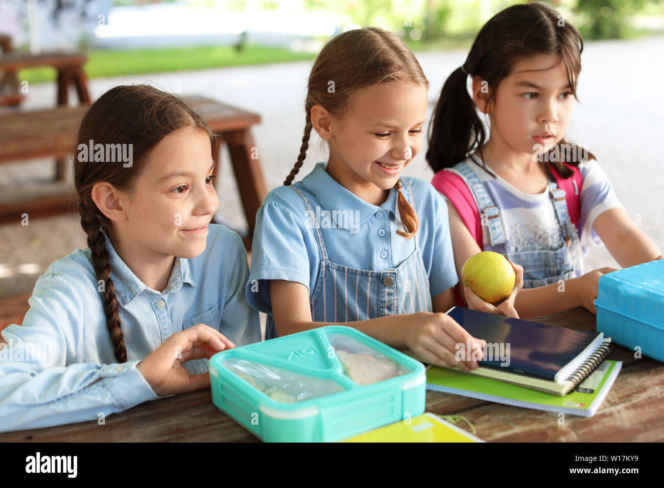 Little children having lunch outdoors Stock Photo - Alamy