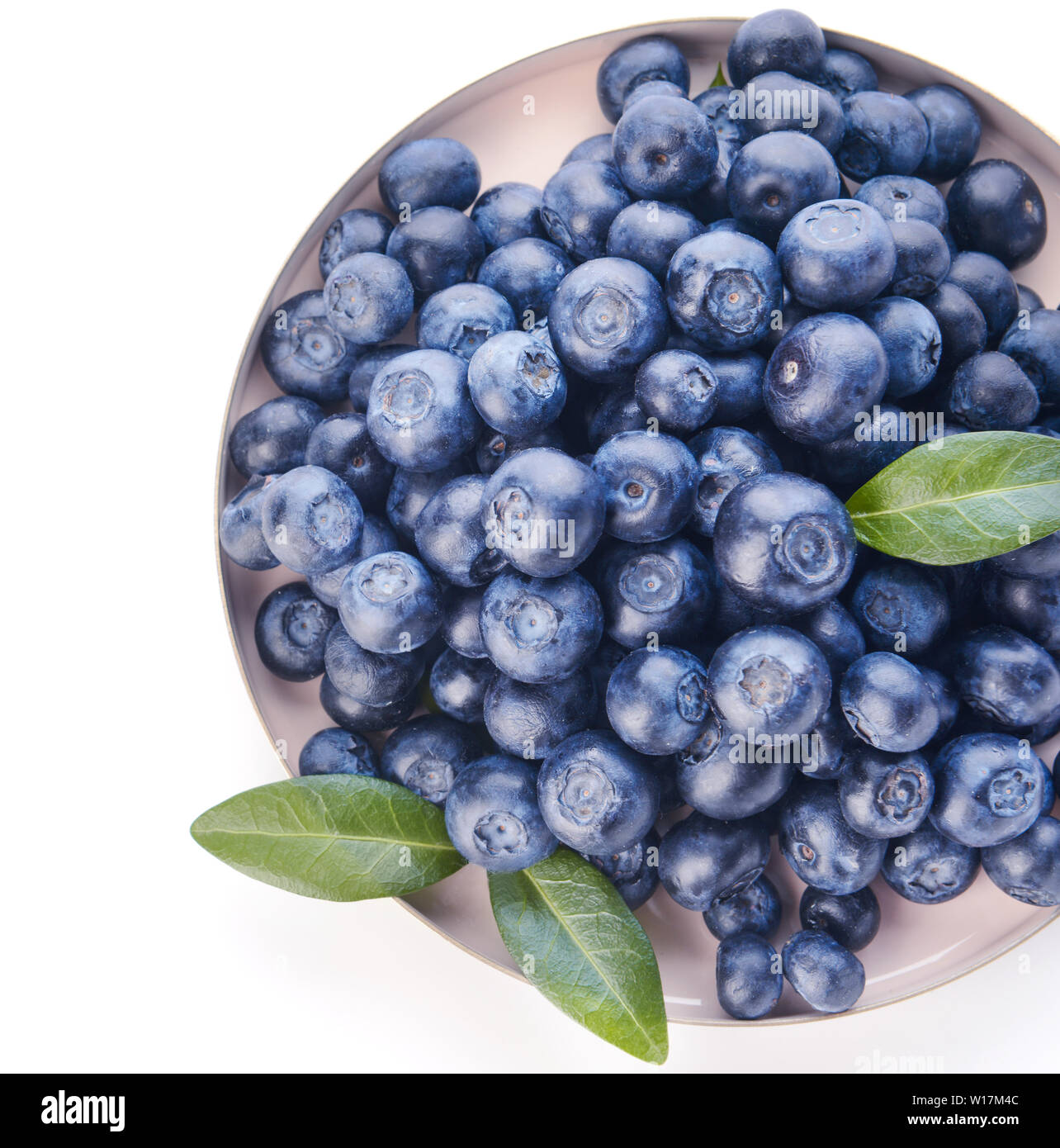 Plate with ripe blueberry on white background Stock Photo - Alamy