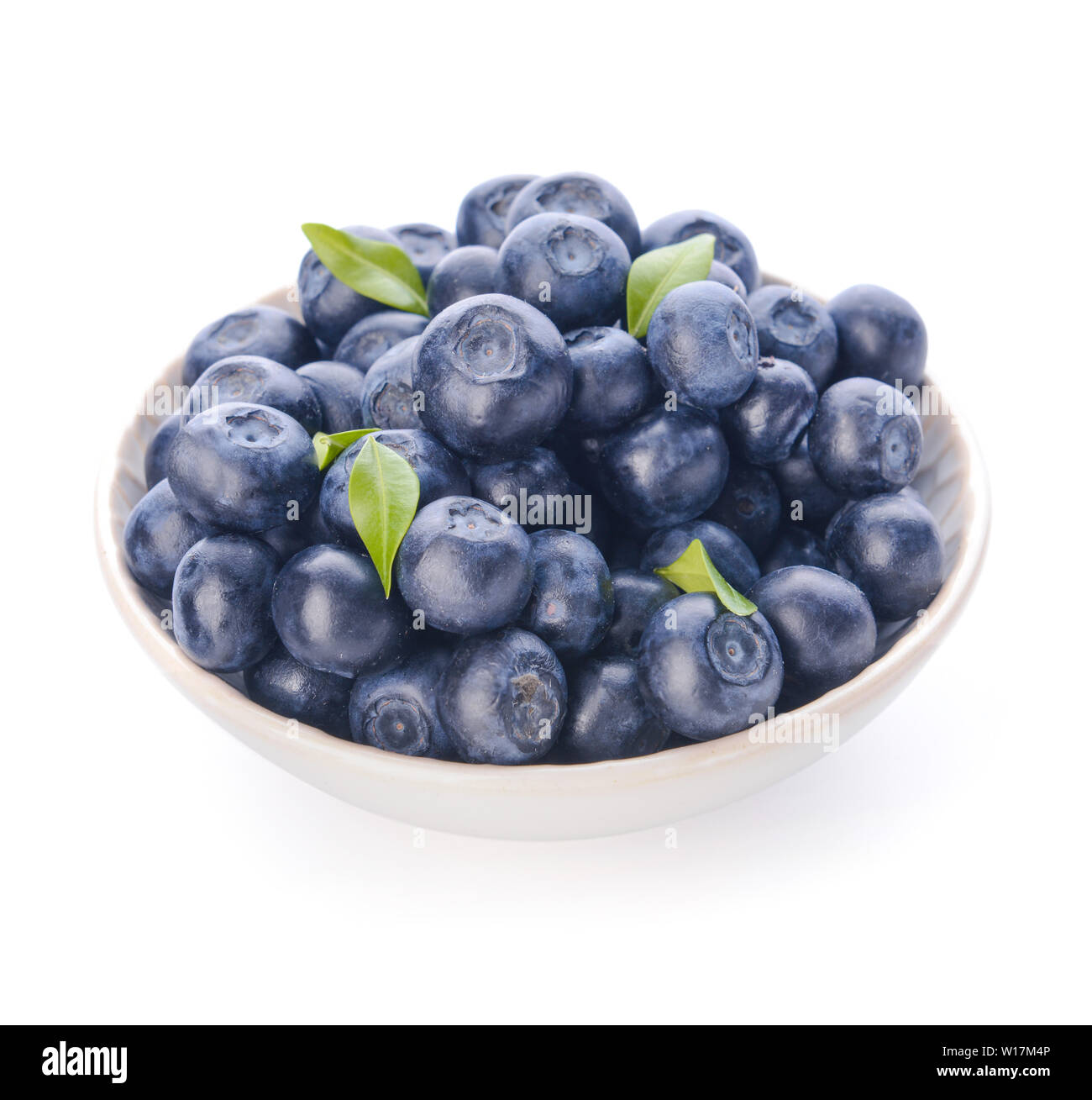 Plate with ripe blueberry on white background Stock Photo - Alamy