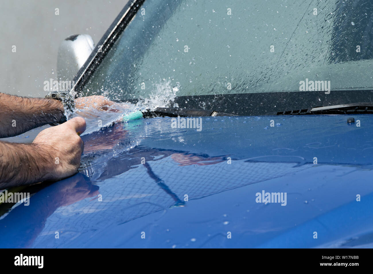 Close up view of man hands washing automobile Stock Photo - Alamy