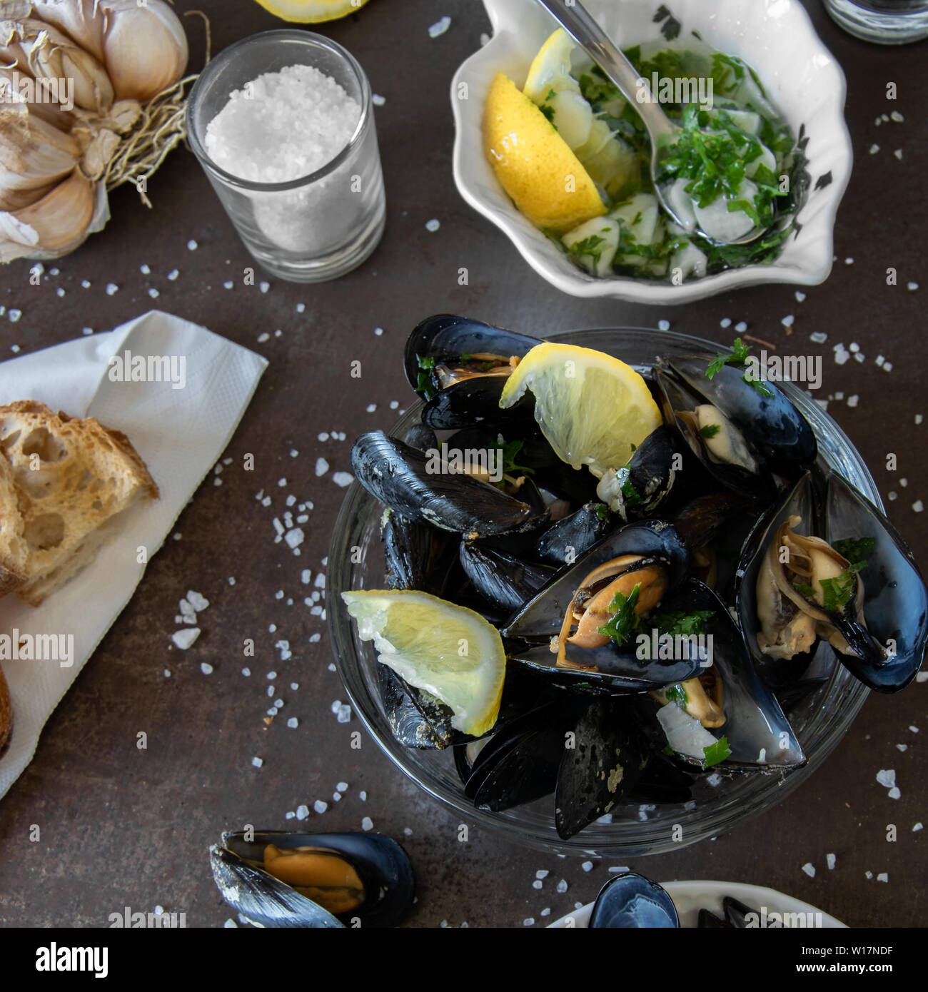 Cooked delicious black mussel with toasted bread and tasty sauce ...