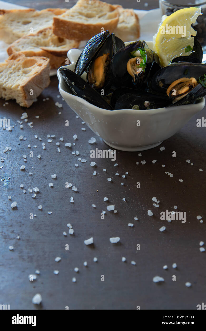 Cooked delicious black mussel with toasted bread. Healthy eating ...